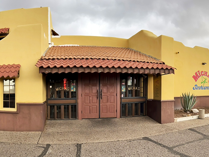 Those wooden double doors aren't just an entrance&mdash;they're a portal to flavor town. The terracotta roof and adobe-style walls set the stage for the culinary performance waiting inside.