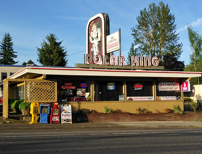 The neon-lit polar bear beckons from the roadside like a nostalgic dream, promising comfort food that never goes out of style.