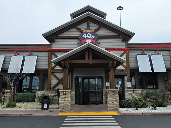 The rustic charm of 49er Diner's exterior welcomes hungry travelers with its Gold Rush-inspired architecture and stone pillars.