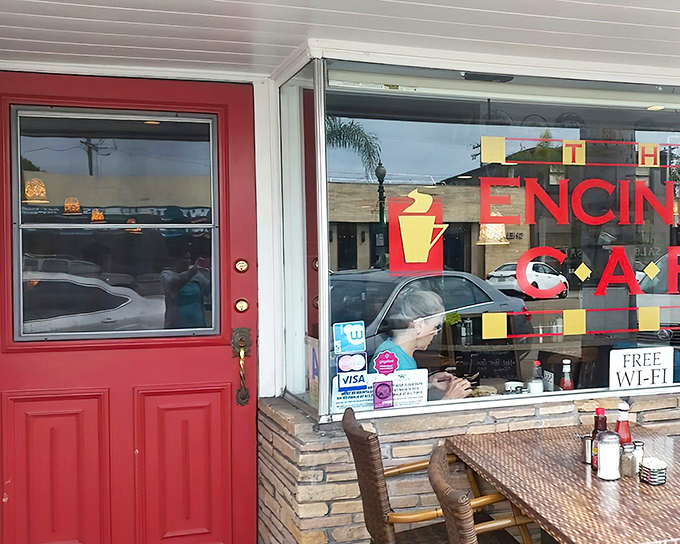 The unassuming exterior of Encinitas Cafe shows that culinary gems often hide in plain sight, with its bold red door and wide glass windows welcoming you inside.