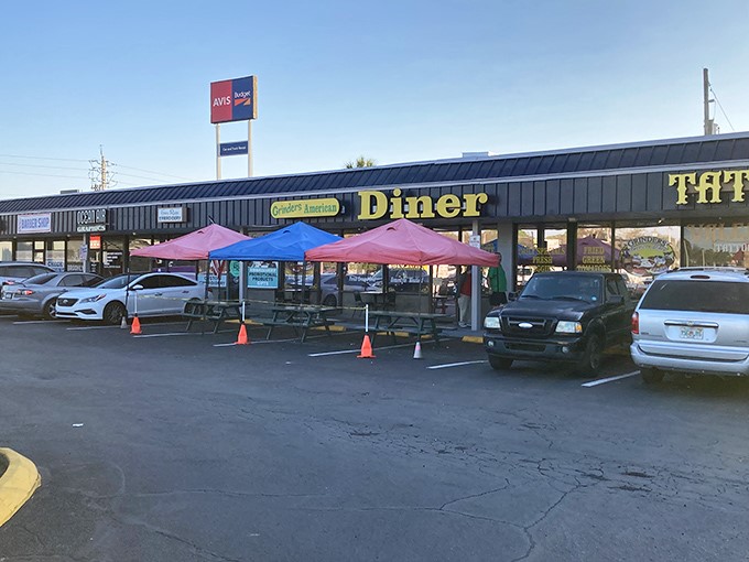 Strip mall treasure hunting at its finest! Grinder's exterior might be unassuming, but those red umbrellas and packed parking lot tell the real story.
