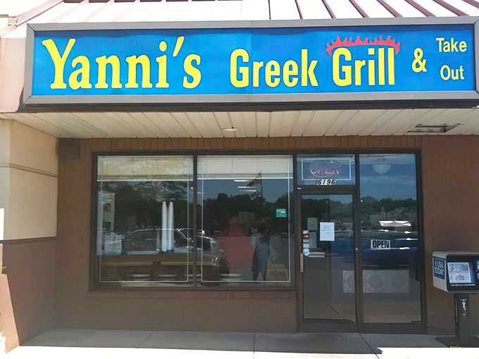 The bright blue awning of Yanni's Greek Grill stands as a Mediterranean beacon in Columbus, promising authentic flavors that transport you straight to the Aegean.