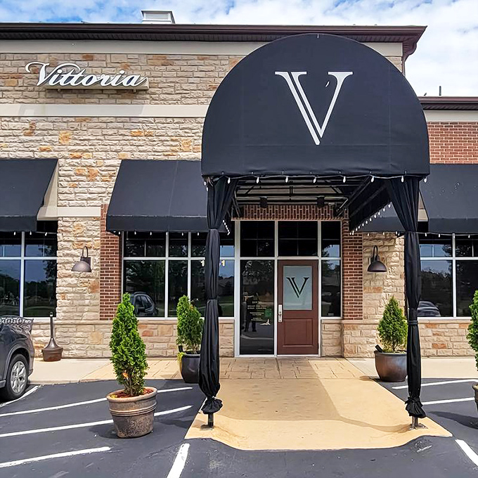 Vittoria's inviting storefront with stone flooring and string lights, promising al fresco dining that rivals any Tuscan countryside experience.