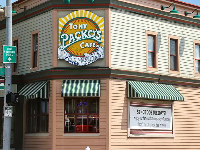 The iconic corner building with its cheerful yellow and green striped awnings stands like a culinary lighthouse, beckoning hungry travelers to Toledo's Hungarian haven.