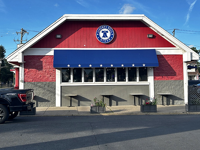 The iconic red and blue facade isn't just eye-catching&mdash;it's a beacon for hungry travelers seeking authentic diner magic in the City of Brotherly Love.
