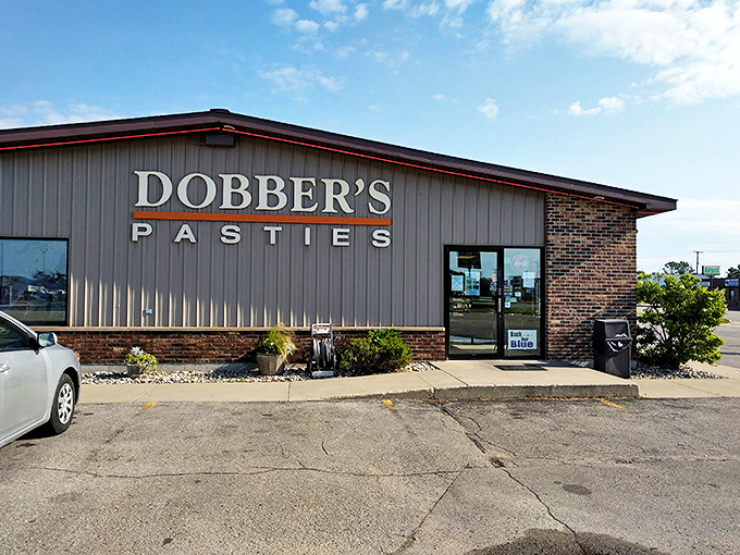 The unassuming exterior of Dobber's Pasties stands like a beacon of comfort food in Escanaba, promising delicious hand-held treasures within.