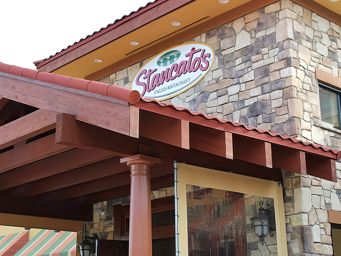 Stancato's stone facade and distinctive red-tiled roof stand as a beacon of Italian culinary promise in Parma, Ohio.