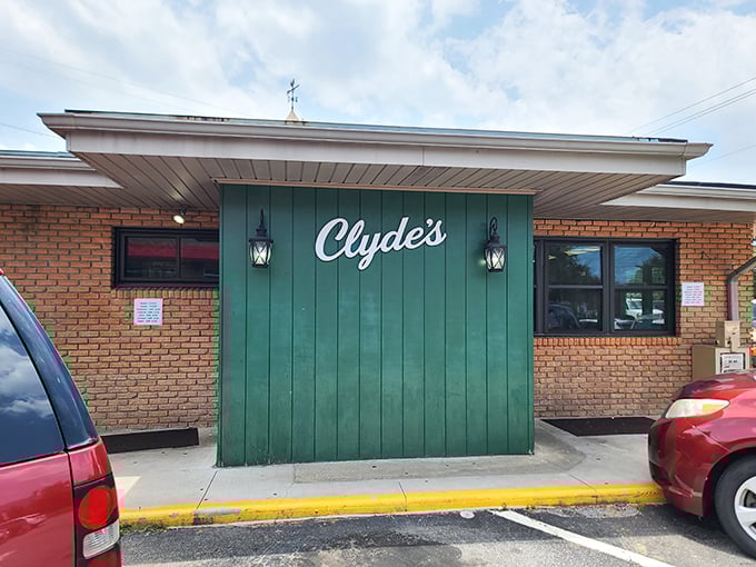 The iconic green facade of Clyde's Restaurant in Waynesville might not scream "culinary destination," but locals know this unassuming entrance hides delicious treasures within. -