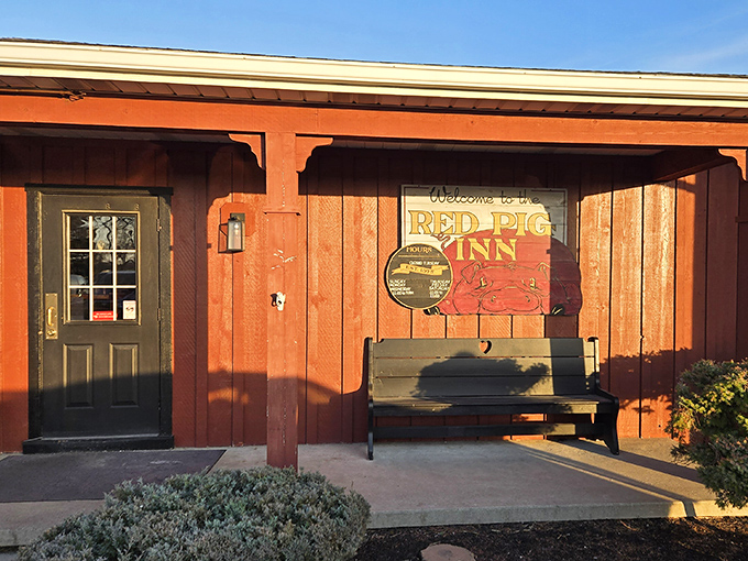 The unassuming exterior of Red Pig Inn proves once again that the best barbecue joints don't need fancy facades&mdash;just a welcoming bench and the promise of smoky delights within.