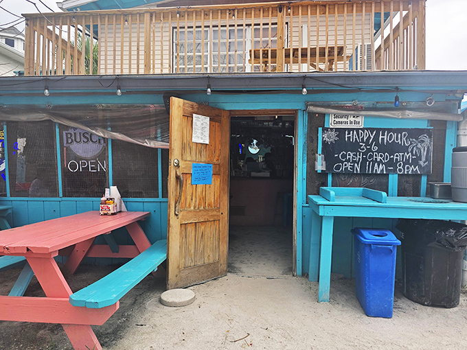 The turquoise beacon of burger bliss stands proudly on Anna Maria Island, promising simple pleasures and island vibes.