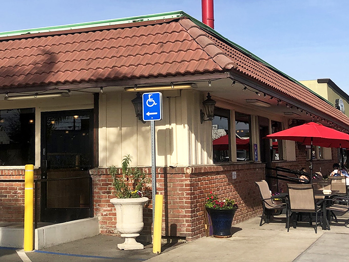 The iconic red sign beckons like a lighthouse for hungry souls. Coral Cafe's unassuming exterior hides a treasure trove of comfort food within.