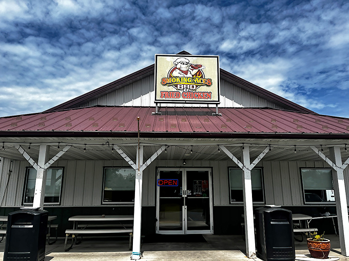 The iconic red roof and cartoon pig logo of Smoking Aces BBQ stand as a beacon of hope for hungry travelers on Pennsylvania's backroads.