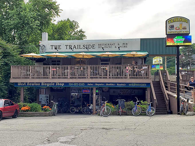 The Trailside stands proudly along the Great Allegheny Passage, its flag-adorned deck practically shouting "Come in, rest those cycling legs, and stay awhile!"
