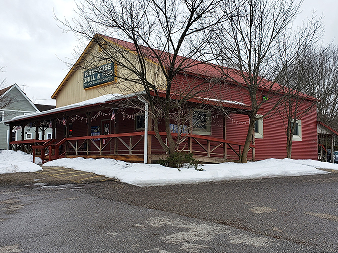 The iconic red exterior of Rootstown Firehouse Grille & Pub stands ready to welcome hungry visitors, its rustic charm promising comfort food salvation.