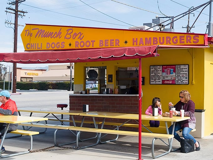The sunshine-yellow landmark stands proudly with its iconic arrow sign, a time capsule of 1950s Americana serving up nostalgia and deliciousness in equal measure.