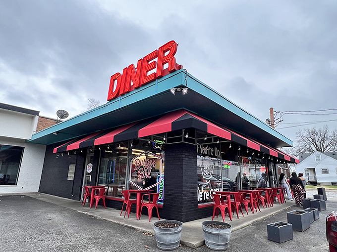 Winter or summer, that bold red DINER sign serves as a beacon for hungry souls, like a lighthouse guiding ships to the safe harbor of good eating.