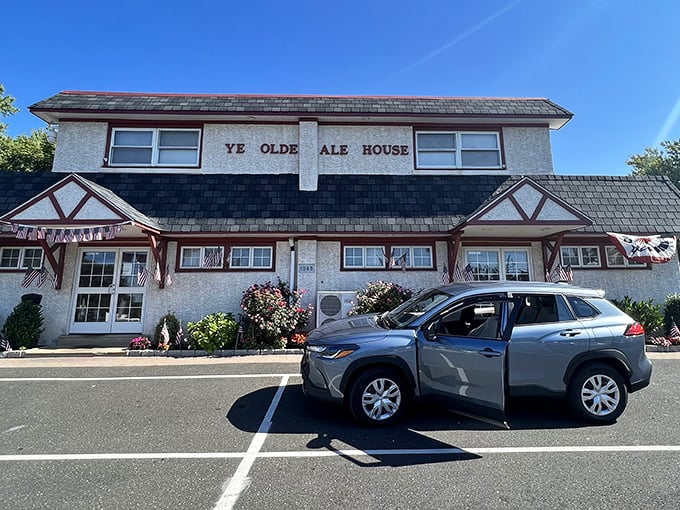 The unassuming Tudor-style exterior of Ye Olde Ale House stands like a humble guardian of culinary treasures. No fancy frills, just honest food awaiting inside.