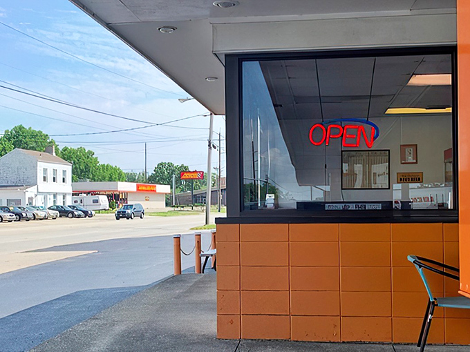 The iconic orange exterior of Jolly's Drive-In stands as a beacon of hope for hungry travelers. This Hamilton landmark promises simple pleasures in a complicated world.