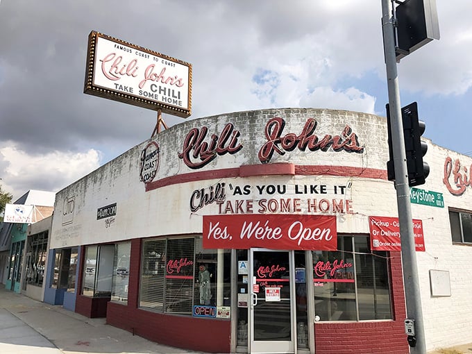 The white and red facade of Chili John's stands like a culinary time machine on Burbank Boulevard, promising comfort food that transcends decades.
