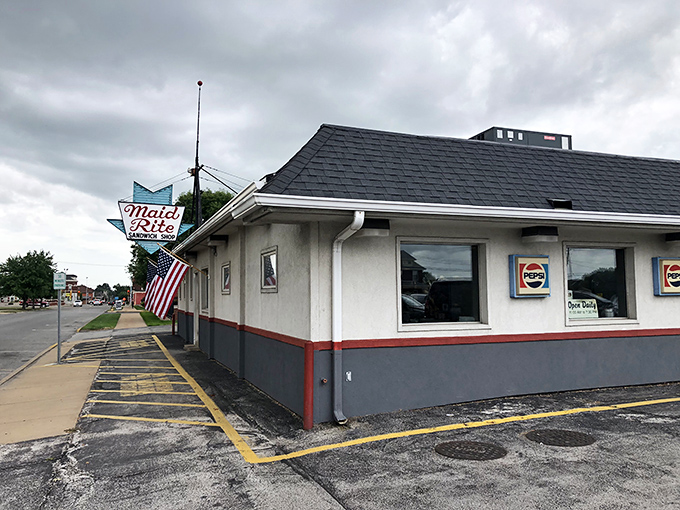 That iconic blue arrow sign beckons like a beacon of comfort food salvation. Midwestern roadside architecture at its most honest and inviting.