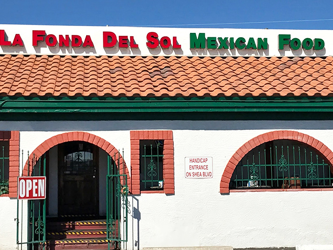 The unassuming exterior of La Fonda Del Sol beckons with its classic Spanish-style roof and distinctive red-trimmed arches&mdash;proof that culinary treasures often hide in plain sight.