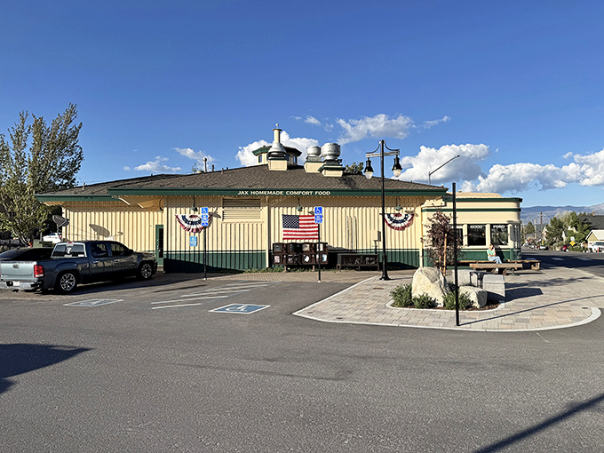 American flags flutter alongside this classic diner, where patriotism and pancakes make perfect breakfast companions.