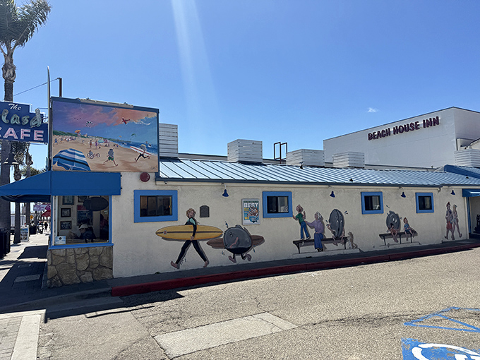 The iconic blue facade of Splash Cafe stands like a beacon of seafood salvation on Pismo Beach's shoreline, complete with surfboard sentinels guarding the entrance.