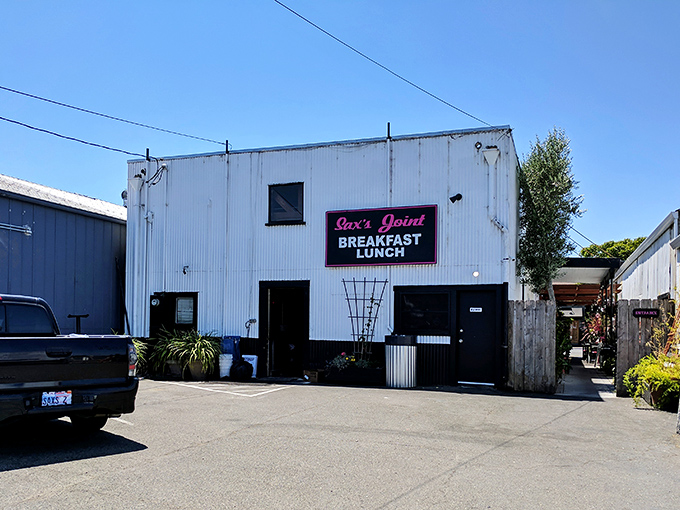 The unassuming exterior of Sax's Joint might fool you, but locals know this white building with the pink neon sign houses breakfast magic worth seeking out.