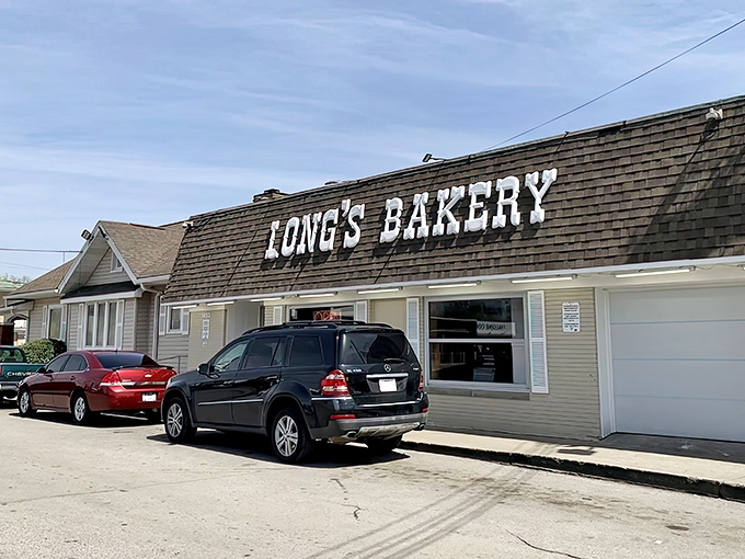 The unassuming brick exterior of Long's Bakery belies the magic happening inside. Culinary treasures rarely announce themselves with neon signs.