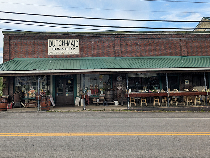 The classic brick facade of Dutch Maid Bakery stands proudly on Tracy City's main drag, a time capsule of culinary tradition with its iconic green awning and welcoming storefront.