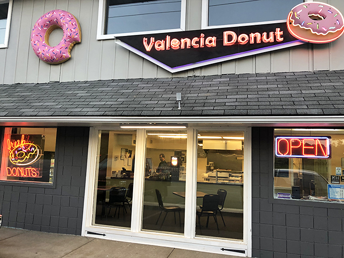 The pink donut signs adorning Valencia Donut's exterior aren't just decoration—they're beacons of hope for the breakfast-obsessed traveler on Pennsylvania's Route 8.