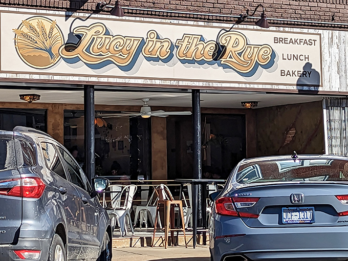 The vintage-style sign for Lucy in the Rye beckons like an old friend against Sylva's classic brick backdrop, promising comfort and culinary adventure in equal measure.