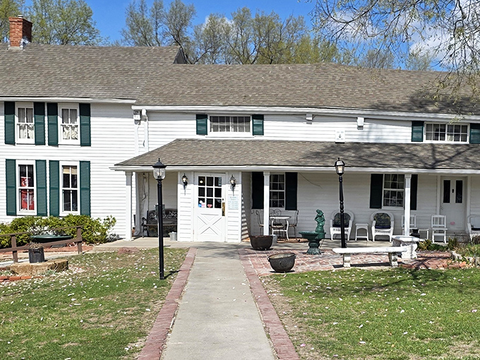 The white farmhouse exterior of Stroud's Oak Ridge Manor welcomes you like an old friend, promising comfort and satisfaction before you even step inside.