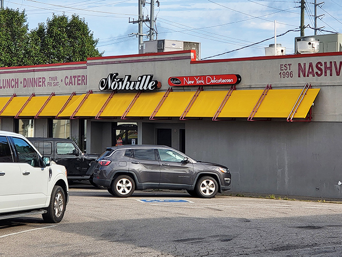 That iconic yellow awning is like a beacon of deli hope in a sea of Nashville hot chicken. Noshville's exterior promises New York authenticity with Tennessee hospitality.