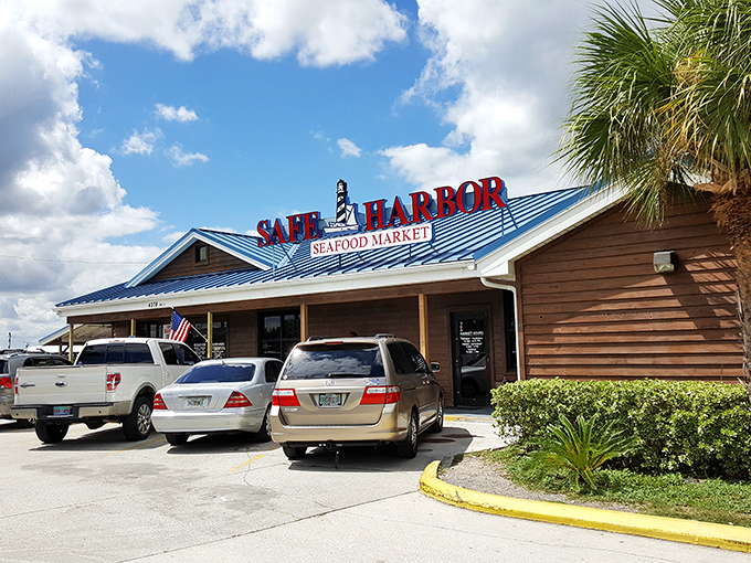 The iconic blue roof of Safe Harbor beckons seafood lovers like a maritime lighthouse, promising treasures from the deep just steps away from Atlantic Beach.