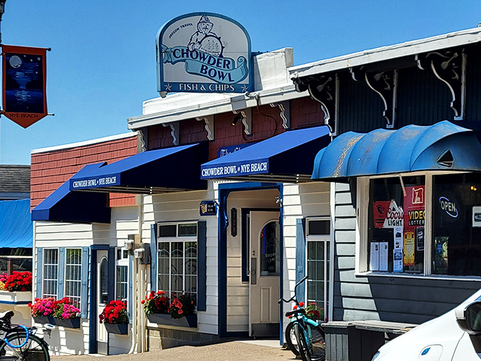 The iconic blue awnings of Chowder Bowl welcome seafood pilgrims to Newport's Nye Beach. This coastal sanctuary promises chowder salvation just steps from the Pacific.