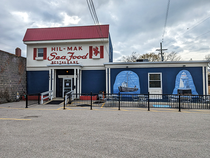 The blue and white exterior of Hil-Mak Seafood Restaurant stands like a maritime beacon in Ashtabula, complete with nautical murals that practically whisper, "Fresh seafood ahead!"