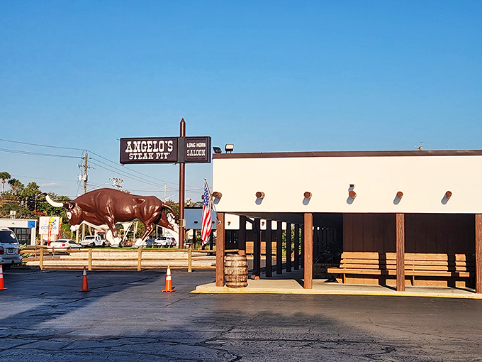 The legendary bull statue stands guard outside Angelo's Steak Pit, a beacon for meat lovers that's as much a Panama City Beach landmark as any sandy shore.