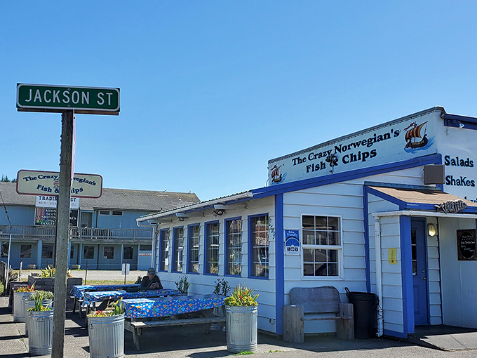 The unassuming white exterior with blue trim might not scream "culinary destination," but locals know this humble facade hides seafood treasures within.