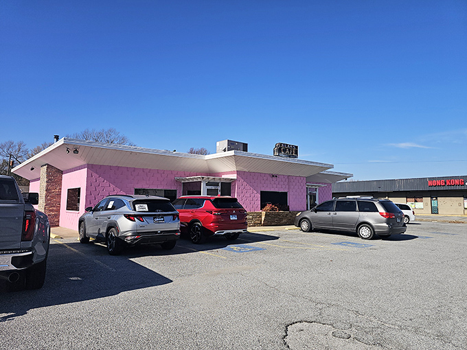 The unmistakable pink exterior of Neal's Cafe stands out like a culinary landmark against the Arkansas sky. Comfort food paradise awaits!