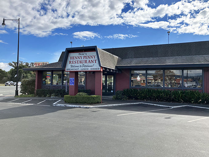 The unassuming pink exterior of Pete's Henny Penny stands like a time capsule of American diner culture, promising comfort food treasures within.