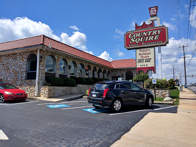 The stone facade and distinctive red roof of Country Squire Diner stand like a culinary lighthouse on West Chester Pike, beckoning hungry travelers with promises of comfort food excellence.