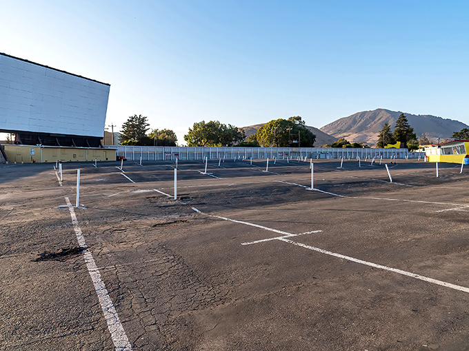 The classic yellow ticket booth stands ready, like a cheerful guardian of good times and double features.