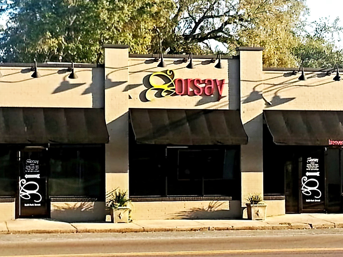 The elegant fa&ccedil;ade of Orsay welcomes you with its distinctive signage, promising a French culinary adventure in Jacksonville's historic Avondale neighborhood.