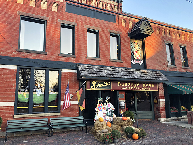 The brick facade of Schmidt's Sausage Haus stands like a delicious time portal to old-world Germany, complete with seasonal decorations that say "Willkommen, hungry friends!"