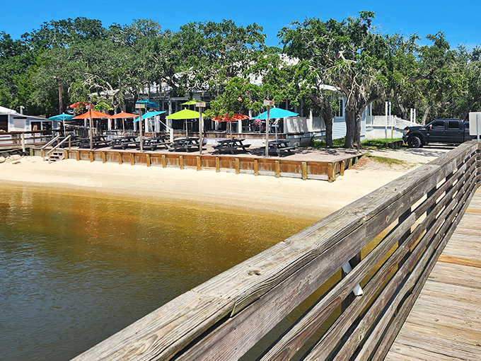 Paradise found! Aunt Kate's waterfront setting combines colorful umbrellas, sandy shores, and shaded picnic tables for the ultimate Florida dining escape.