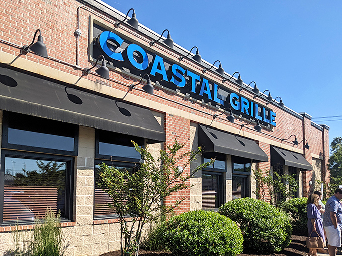 The bright blue signage against the warm brick exterior creates that perfect "I've discovered something special" moment before you even step inside.