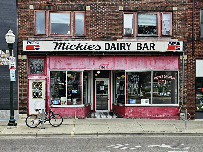 The iconic pink facade of Mickies Dairy Bar stands as a beacon of breakfast hope on Monroe Street, unchanged while Madison has transformed around it.