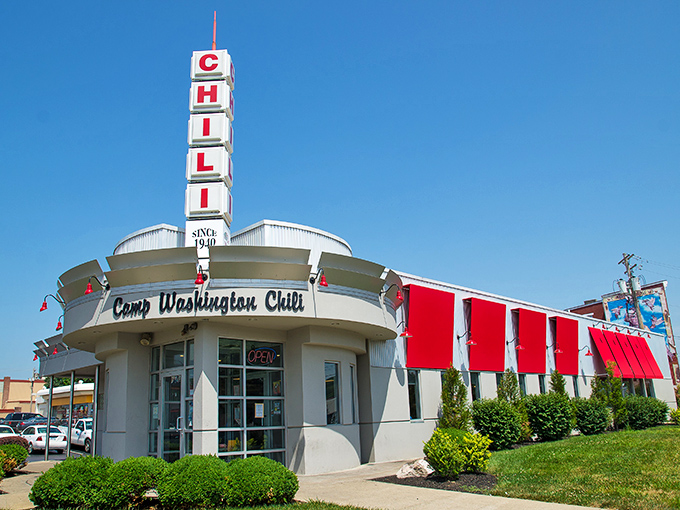 The iconic Camp Washington Chili sign stands tall against the blue Cincinnati sky, beckoning hungry travelers like a neon lighthouse for comfort food.