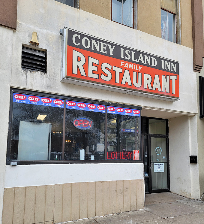 The iconic Coney Island Inn sign beckons hungry travelers like a neon lighthouse guiding ships to the harbor of comfort food.
